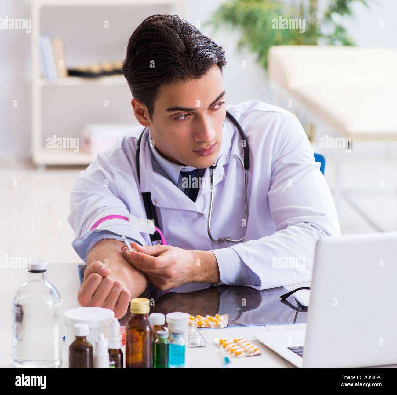 The doctor drug addict in the hospital Stock Photo - Alamy