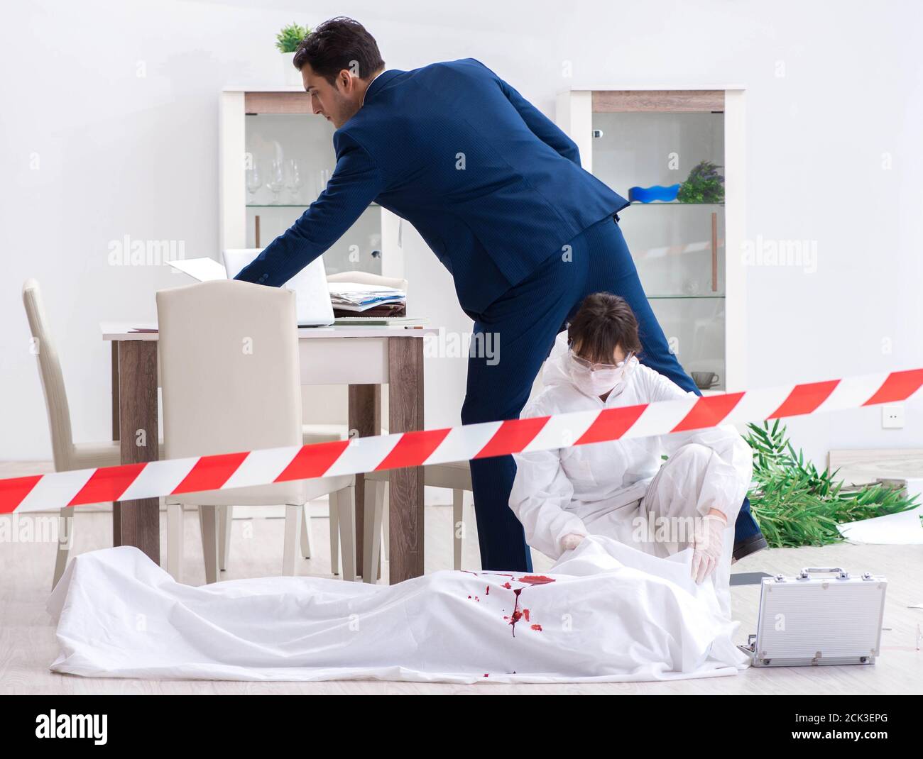 The forensics investigator at the scene of office crime Stock Photo - Alamy