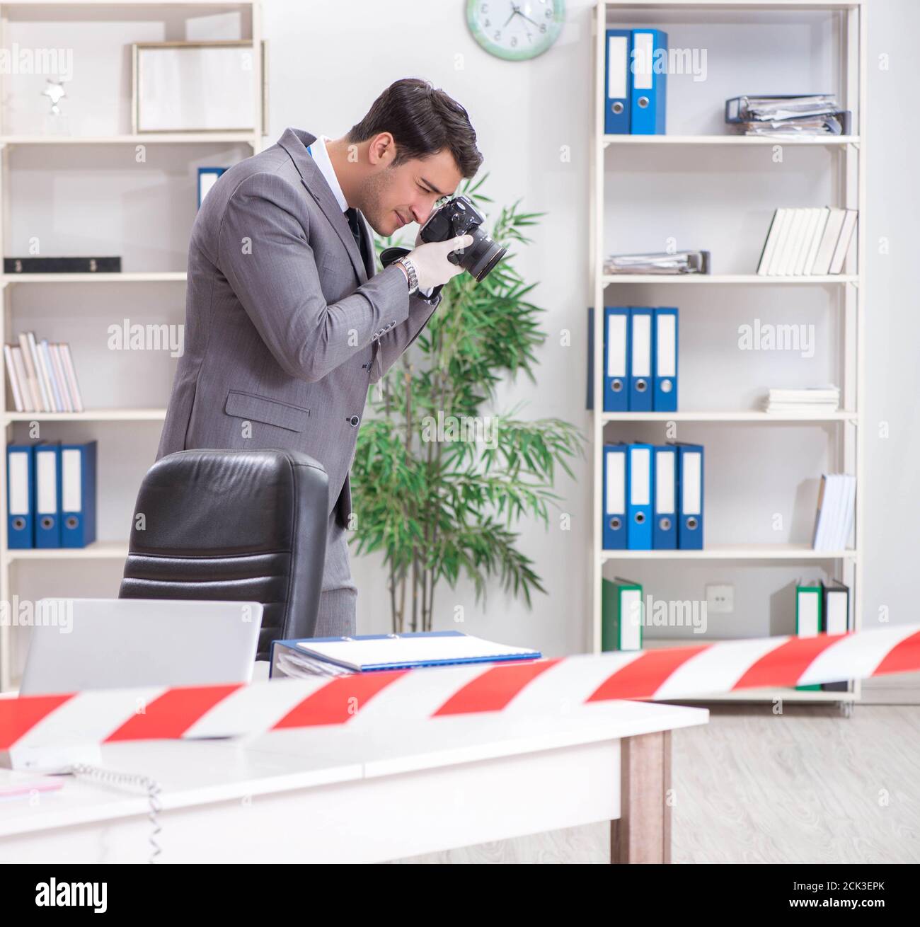 The forensics investigator at the scene of office crime Stock Photo - Alamy