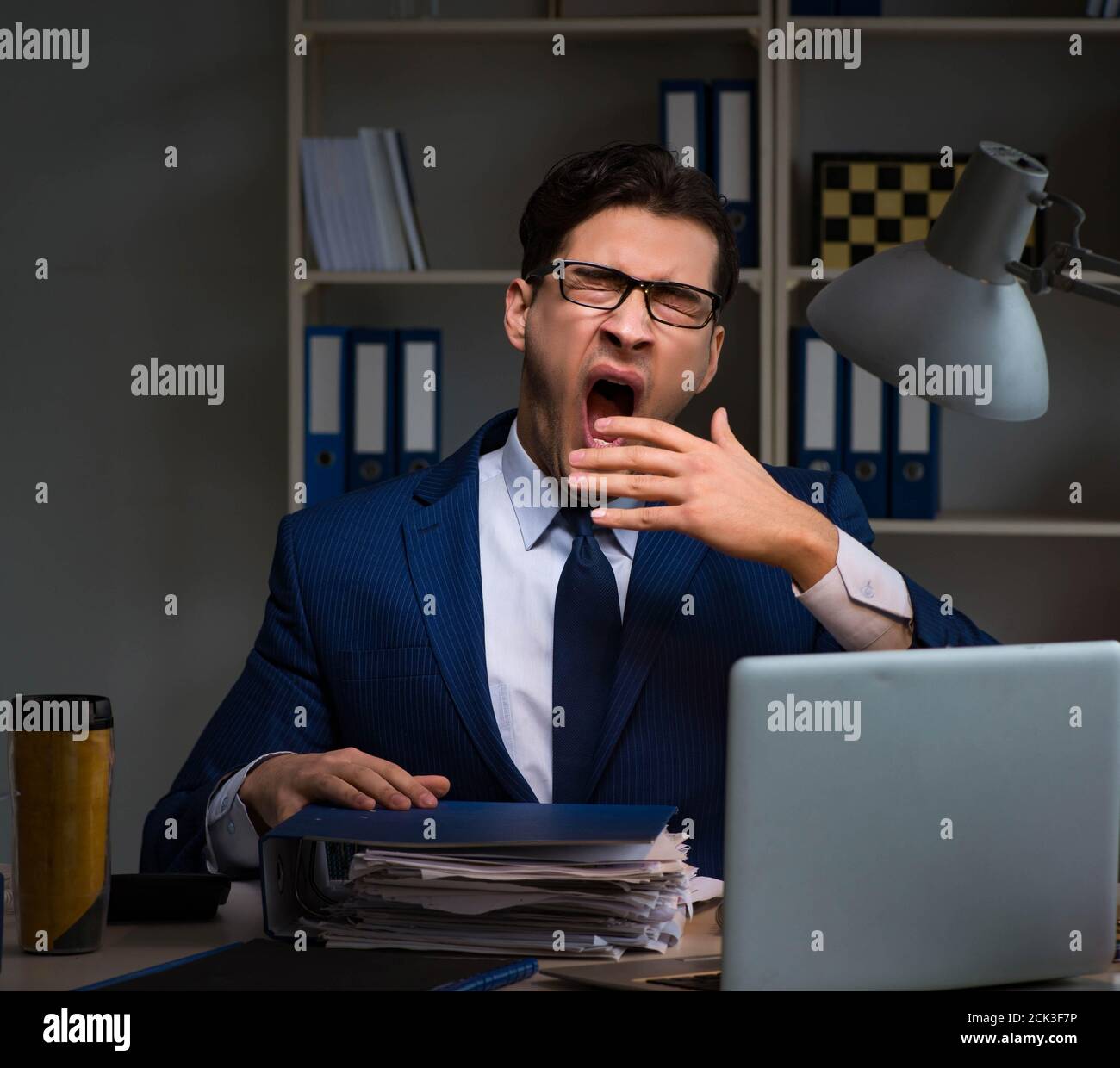 The employee working late to finish important deliverable task Stock ...