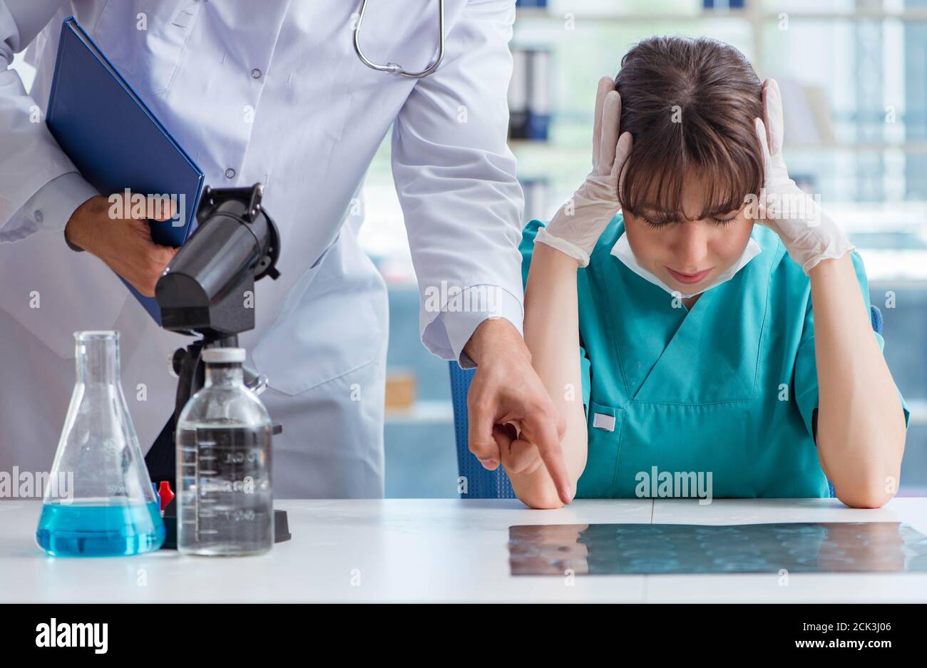 The doctor angry at his assistant due to medical error Stock Photo - Alamy