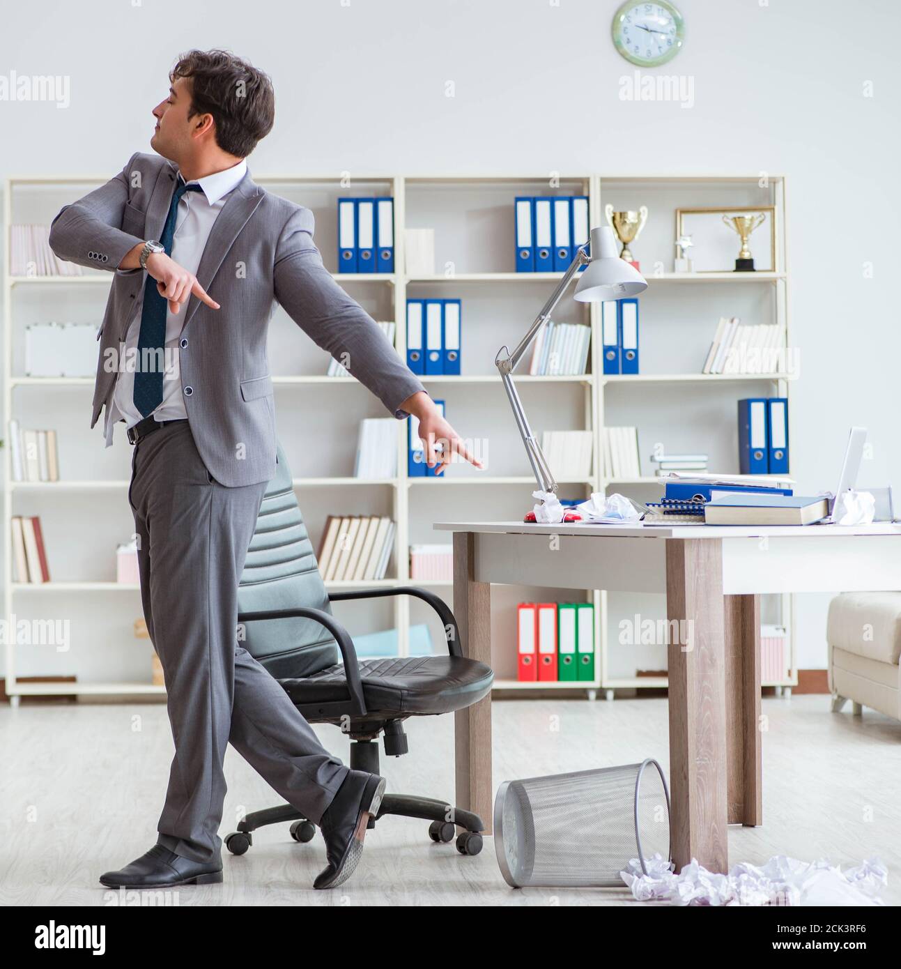 Businessman having fun taking a break in the office at work Stock Photo ...