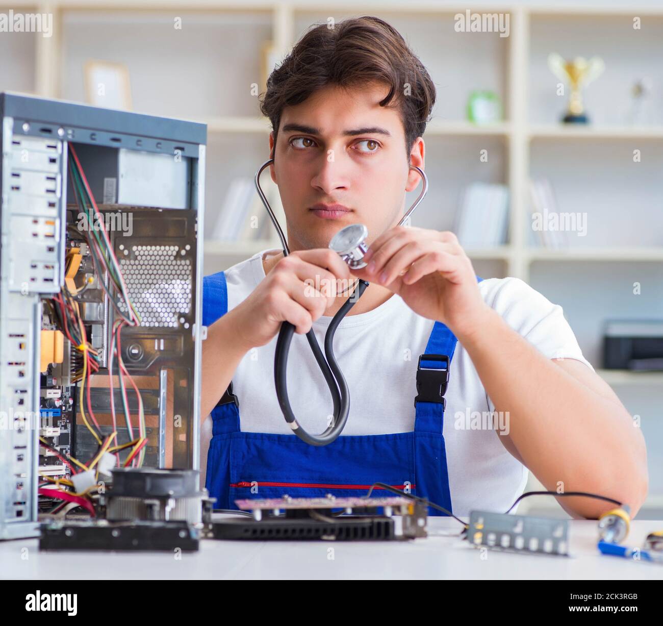 Computer repairman repairing desktop computer Stock Photo - Alamy