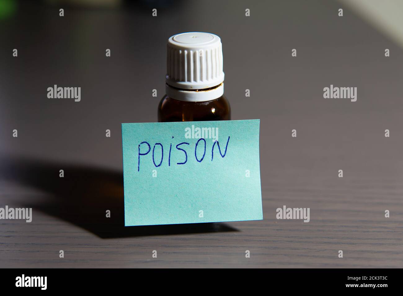 Container for medicinal liquid with a white lid and brown glass labeled ...
