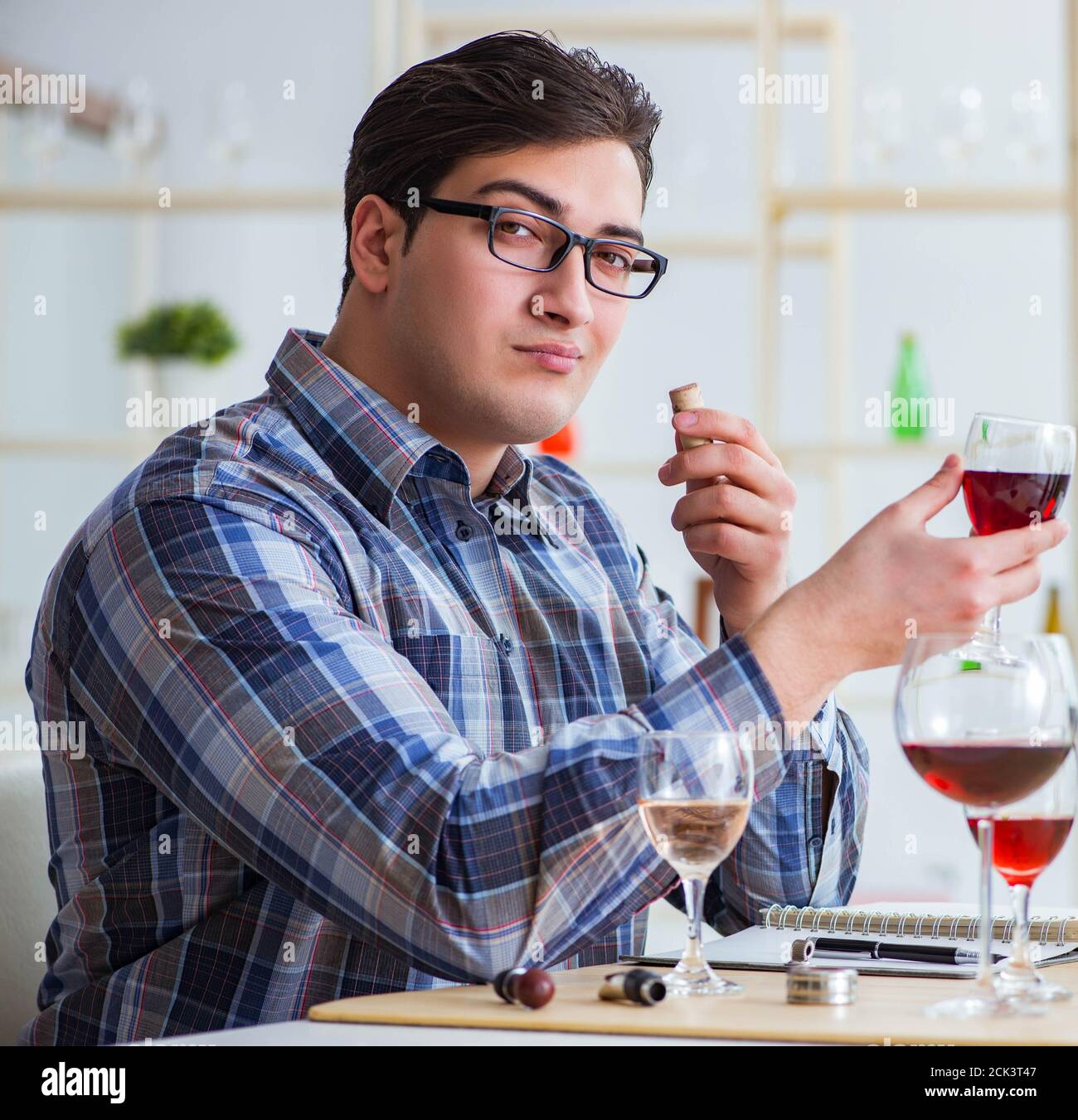 Professional sommelier tasting red wine Stock Photo - Alamy