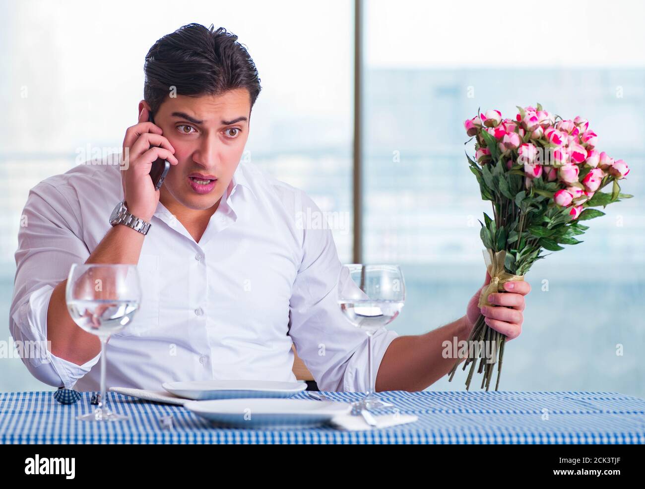 Angry man sitting alone at dinner table hi-res stock photography and ...