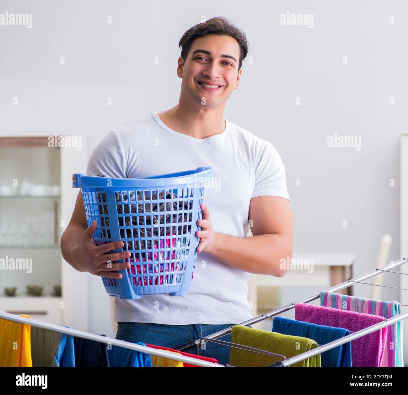 The man doing laundry at home Stock Photo - Alamy