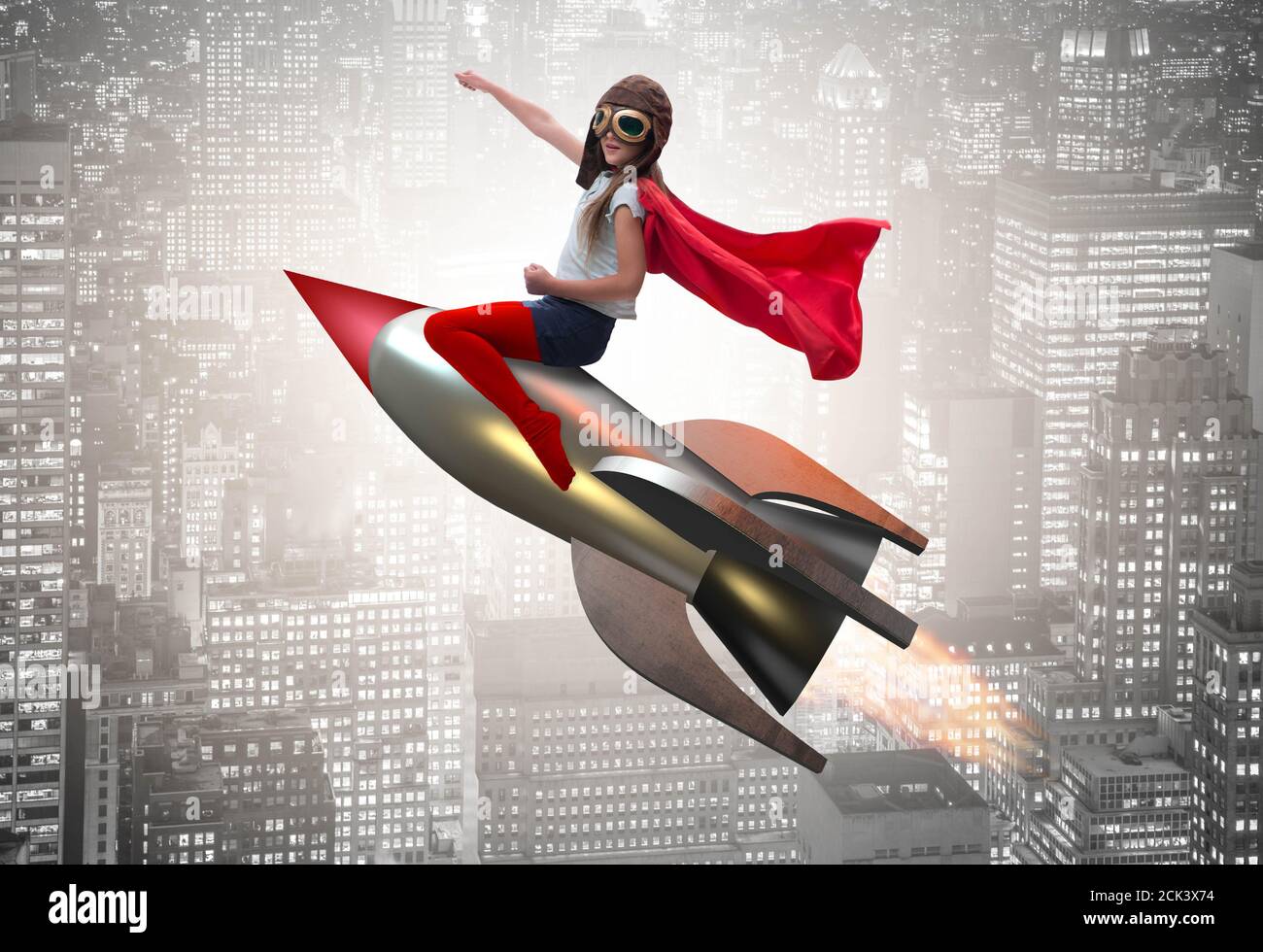 The little girl flying rocket in superhero concept Stock Photo - Alamy
