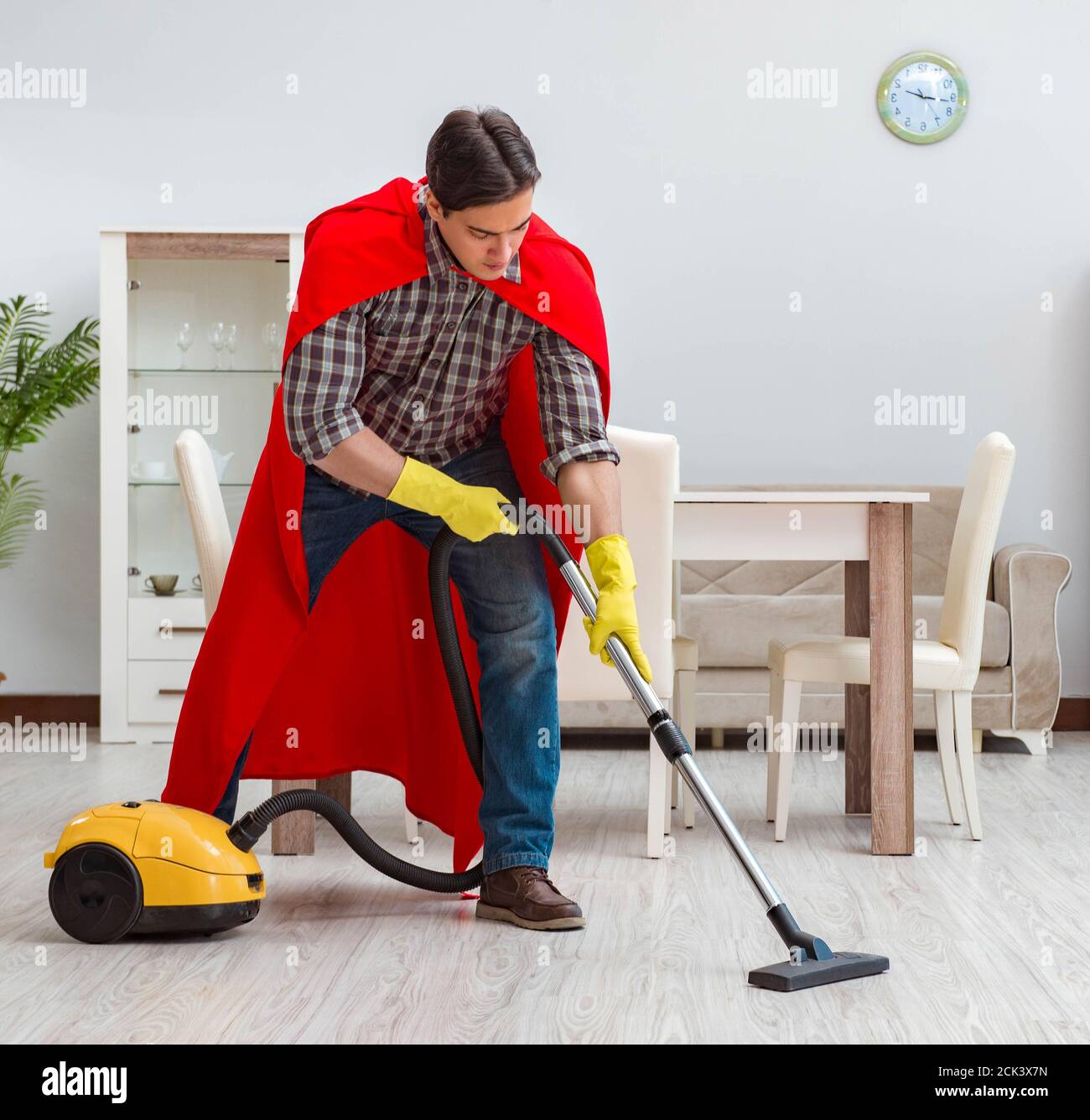 The super hero cleaner working at home Stock Photo - Alamy