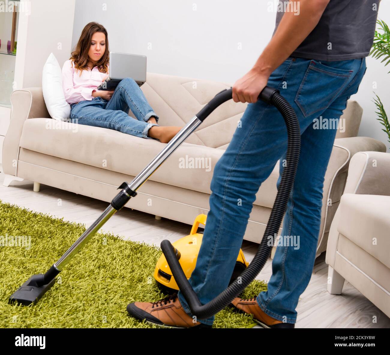 Cleaning the house with vacuum cleaner Stock Photo - Alamy