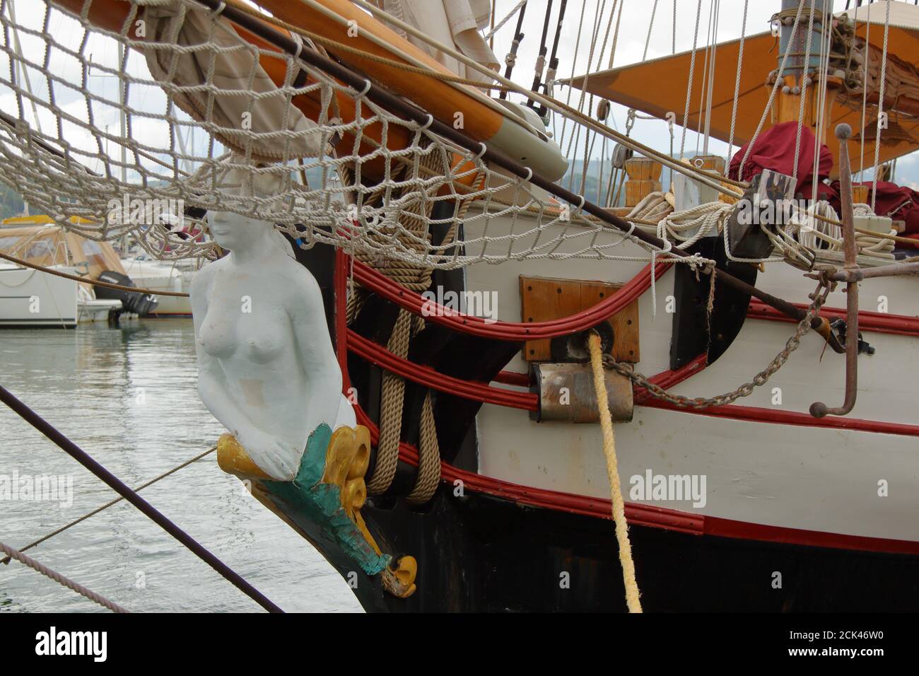 a beautiful figurehead on the bow of a sailboat in the port of LaSpezia ...