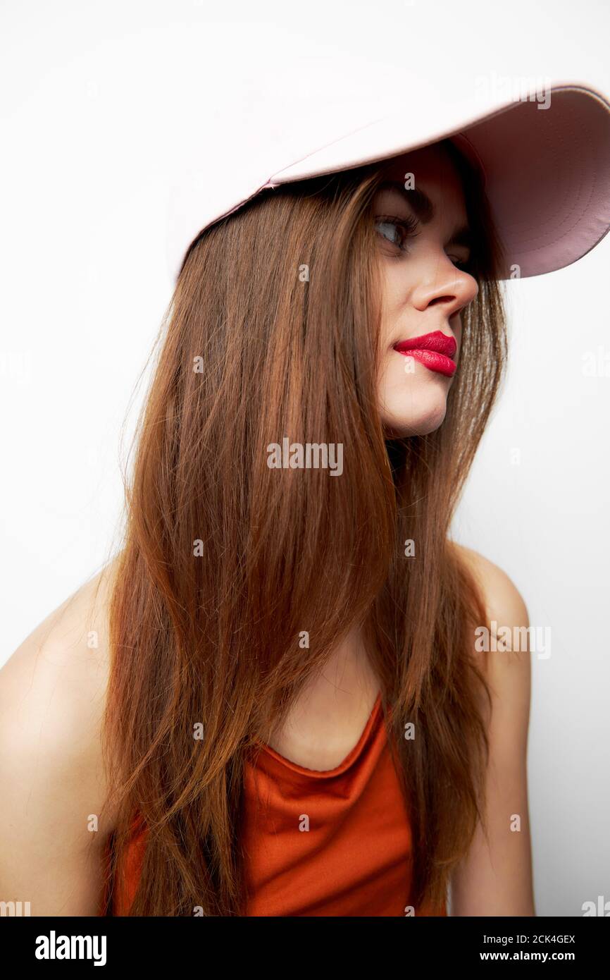 Woman with a cap charm model side view on her head red dress Stock ...