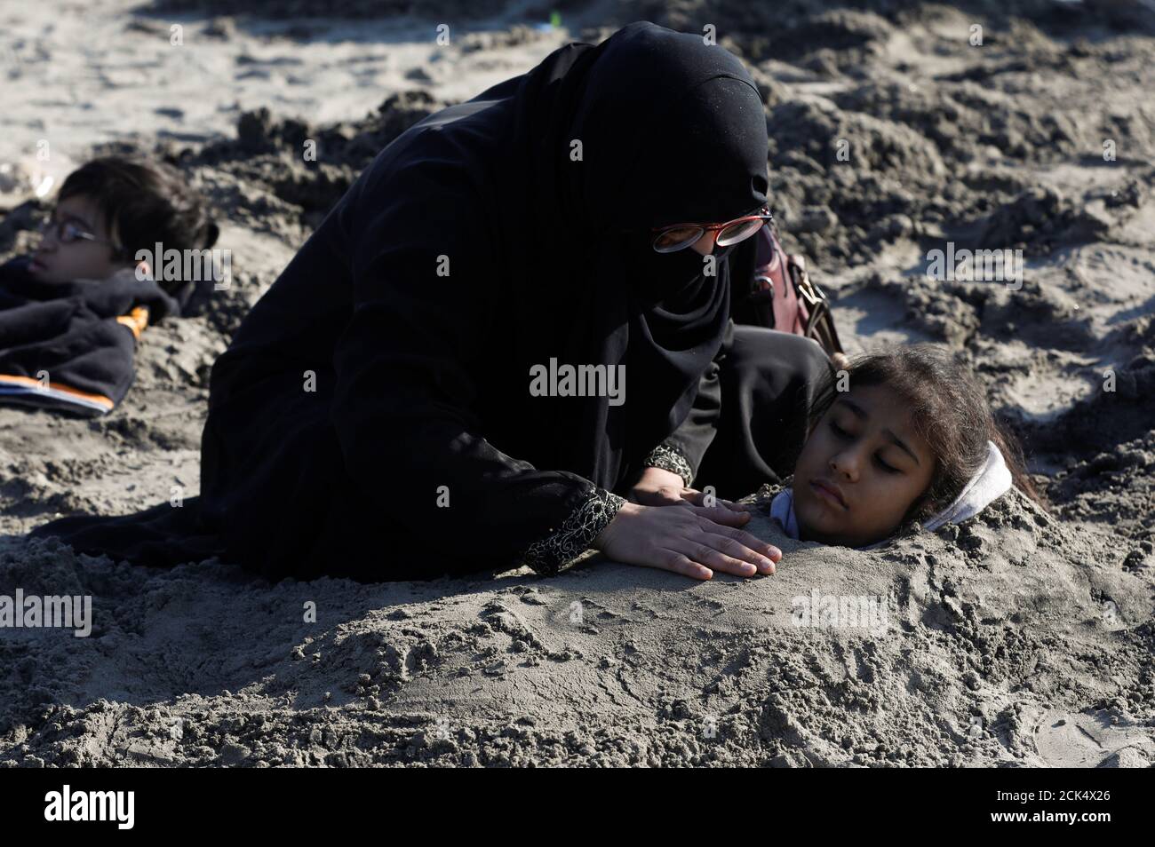 Buried sand woman hi-res stock photography and images - Alamy