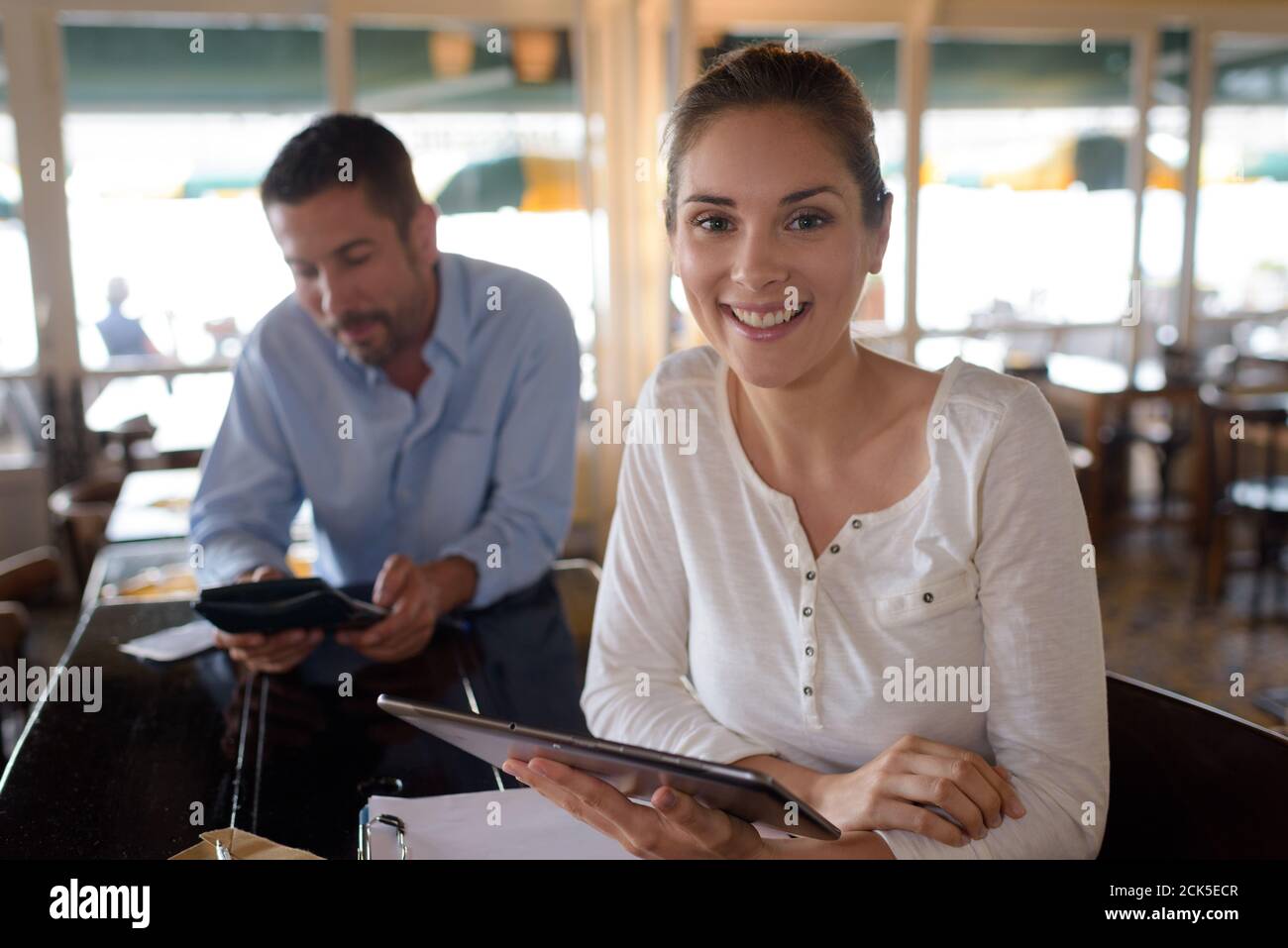 restaurant female owner posing and smiling Stock Photo - Alamy