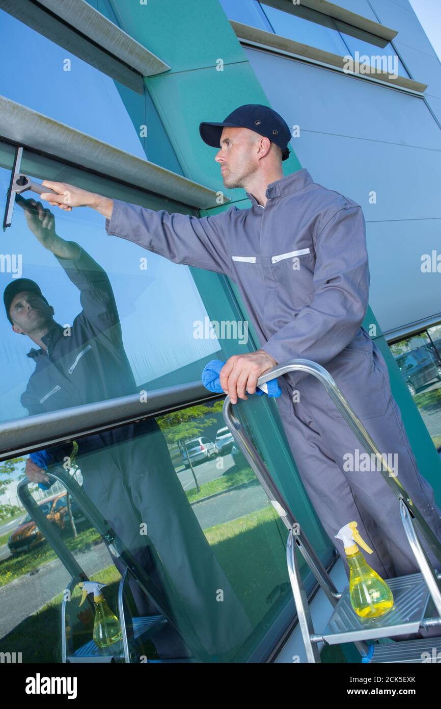 a male professional window cleaner Stock Photo - Alamy