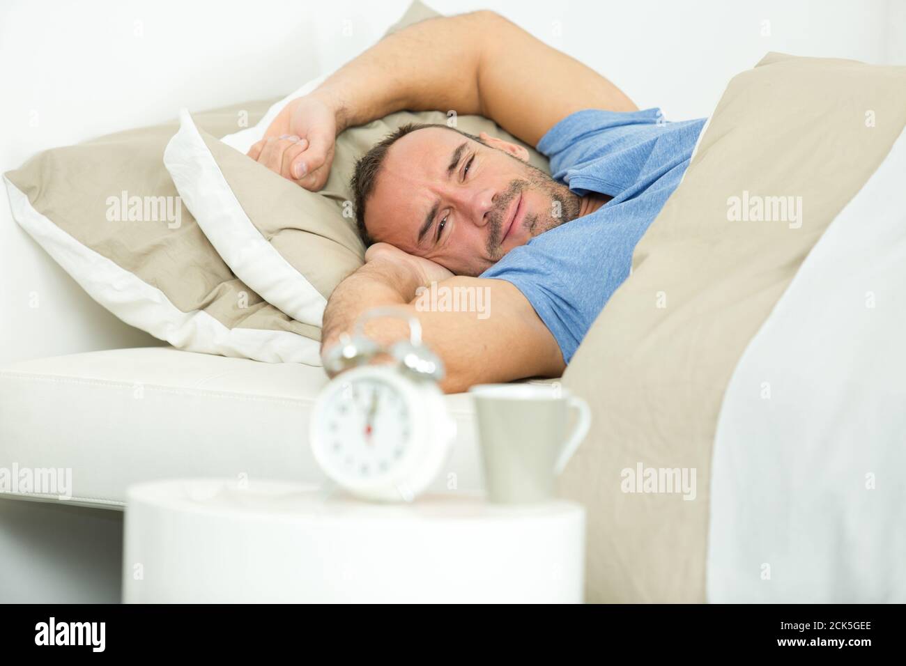 nice handsome man waking up Stock Photo - Alamy