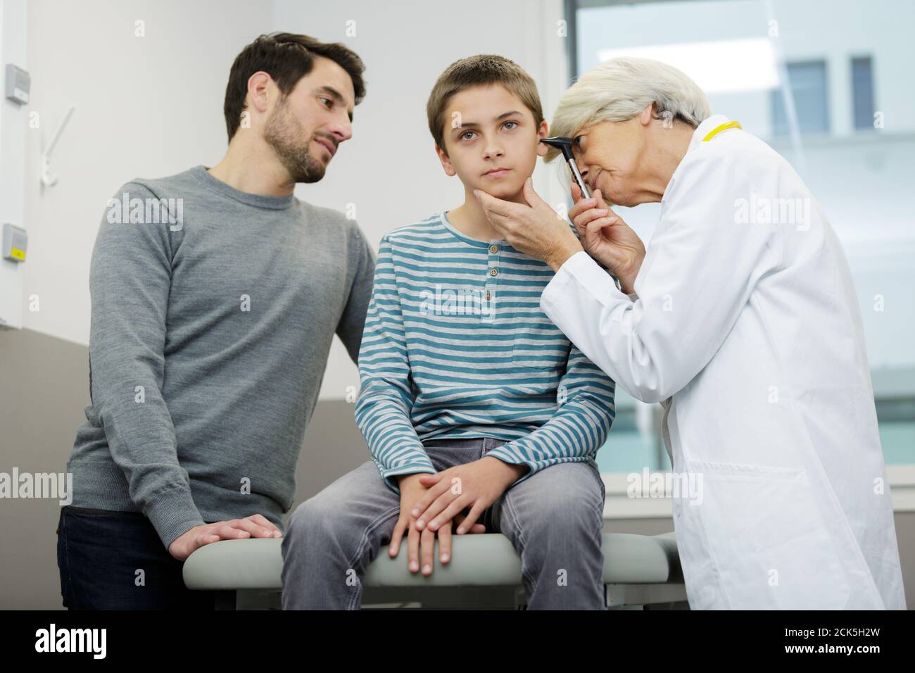 Boy at hearing clinic hi-res stock photography and images - Alamy