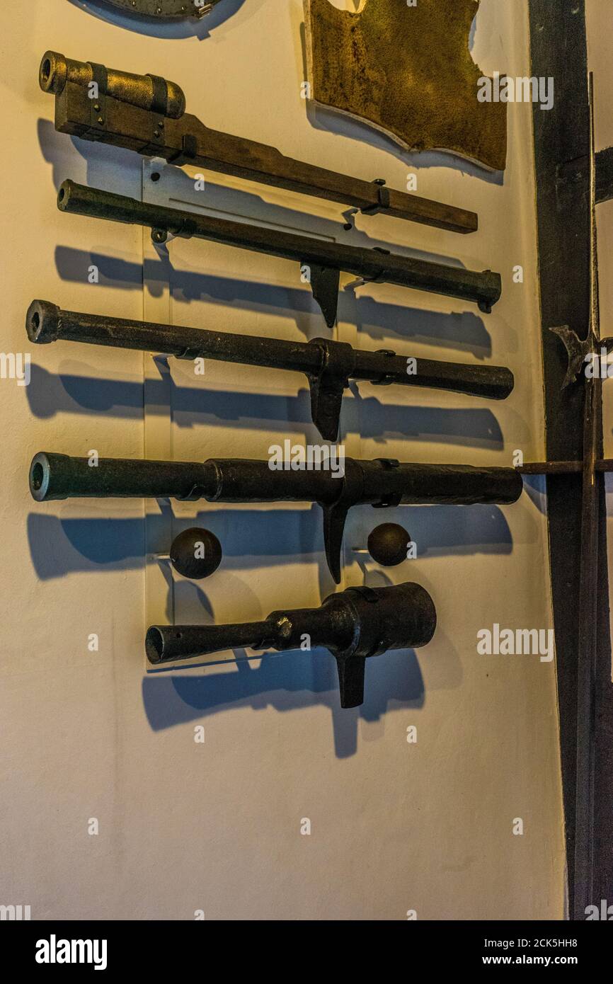 Vertical shot of ancient weapons on display at a museum Stock Photo - Alamy