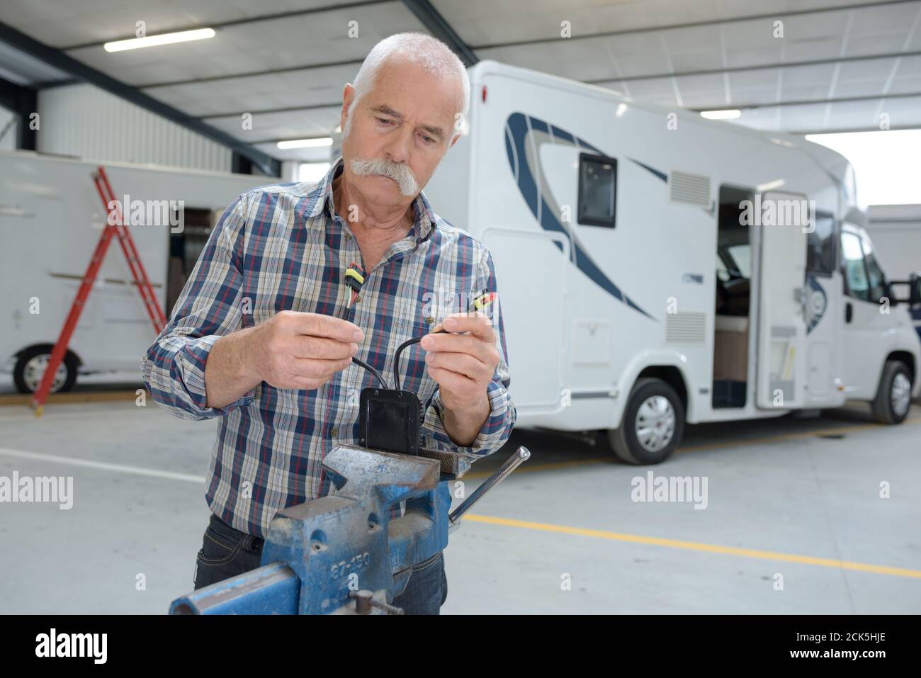 a campervan mechanic at work Stock Photo - Alamy