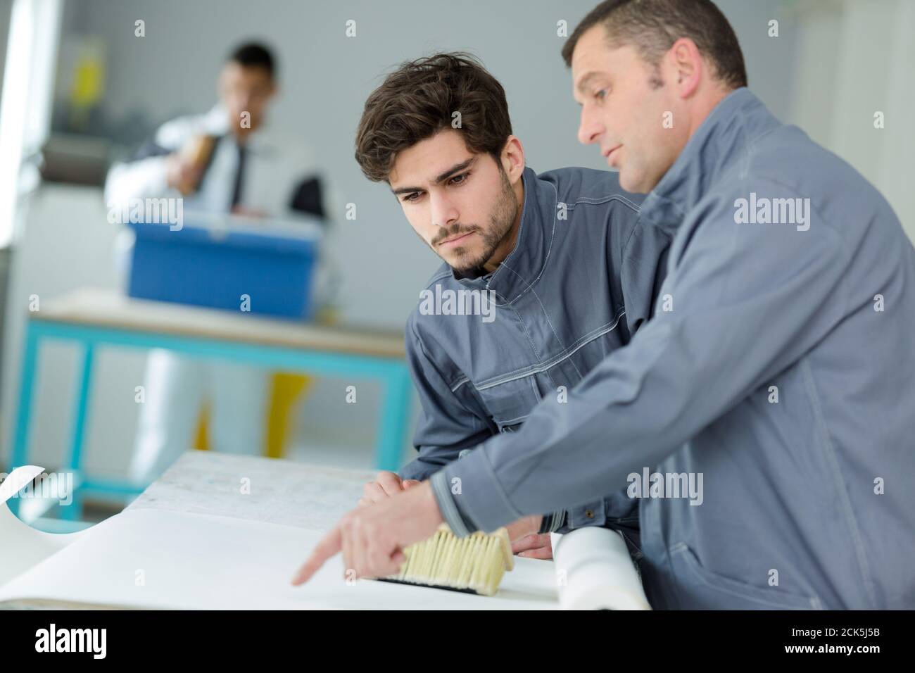 apprentice during explanation Stock Photo - Alamy