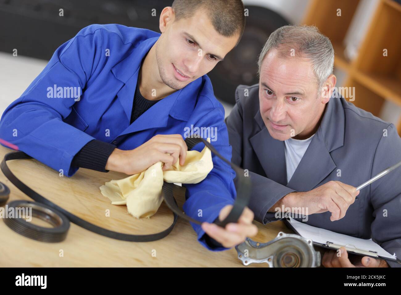 student with auto part studying automotive trade Stock Photo - Alamy