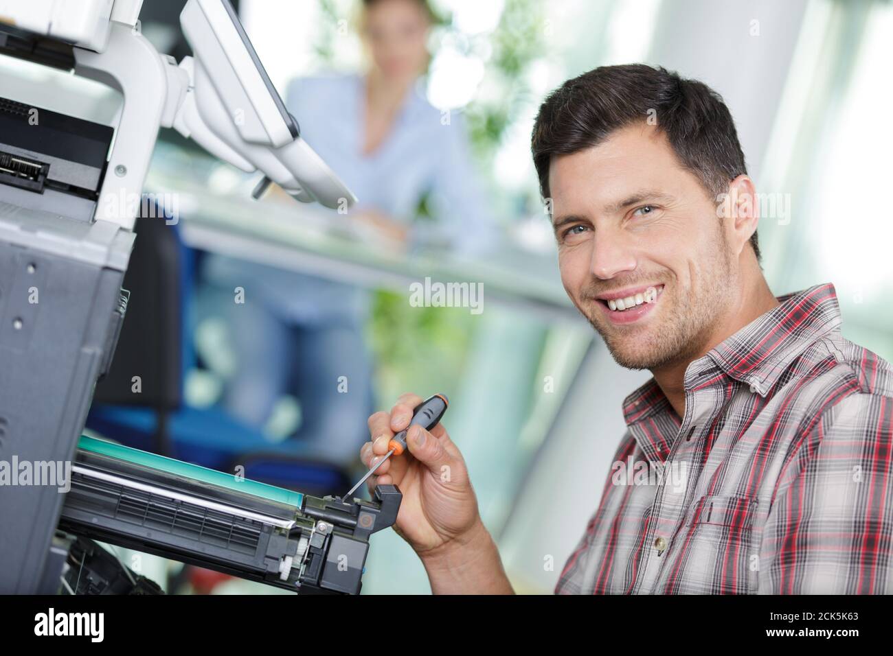 Photocopier repair man hi-res stock photography and images - Alamy