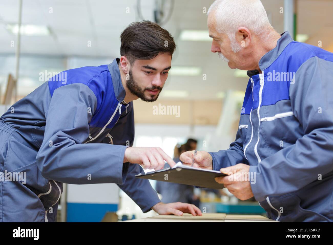 petrochemical co-workers working at plant Stock Photo - Alamy