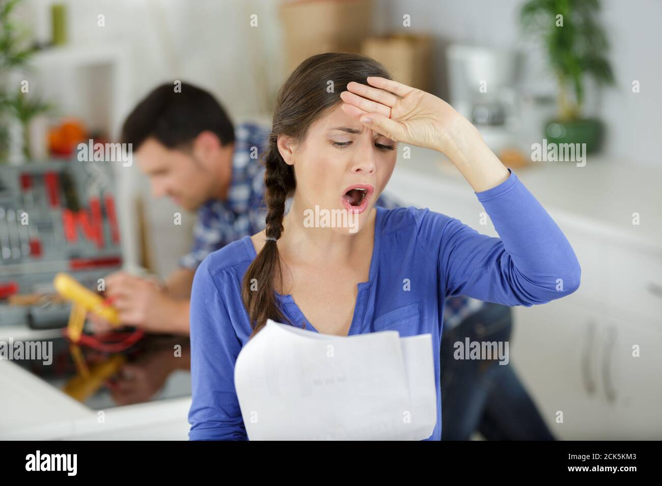 angry woman with an expensive bill Stock Photo - Alamy