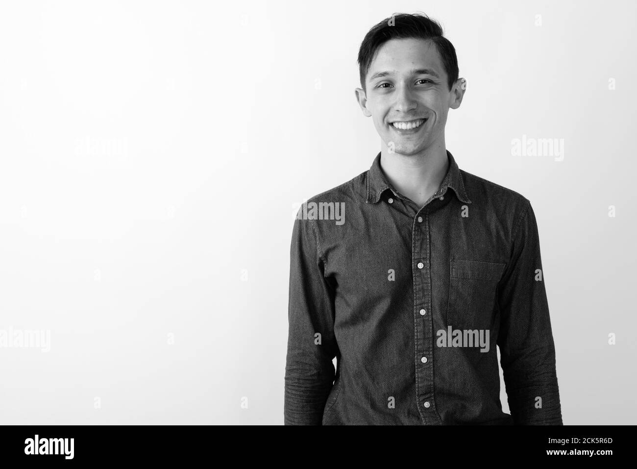 Happy smiling man white background Black and White Stock Photos ...