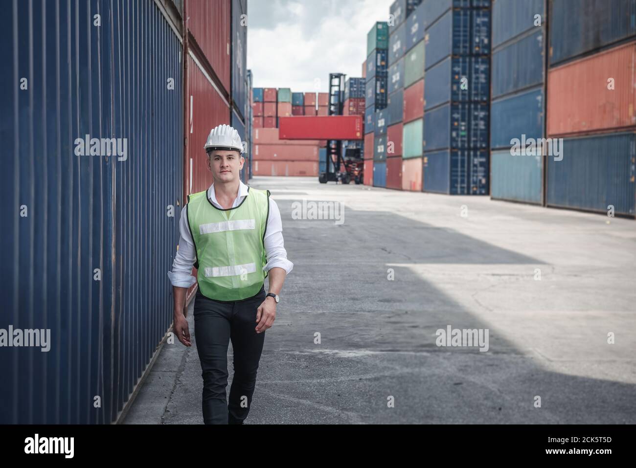 Container Ship Logistics Engineer Worker is Working in Yard Shipping ...