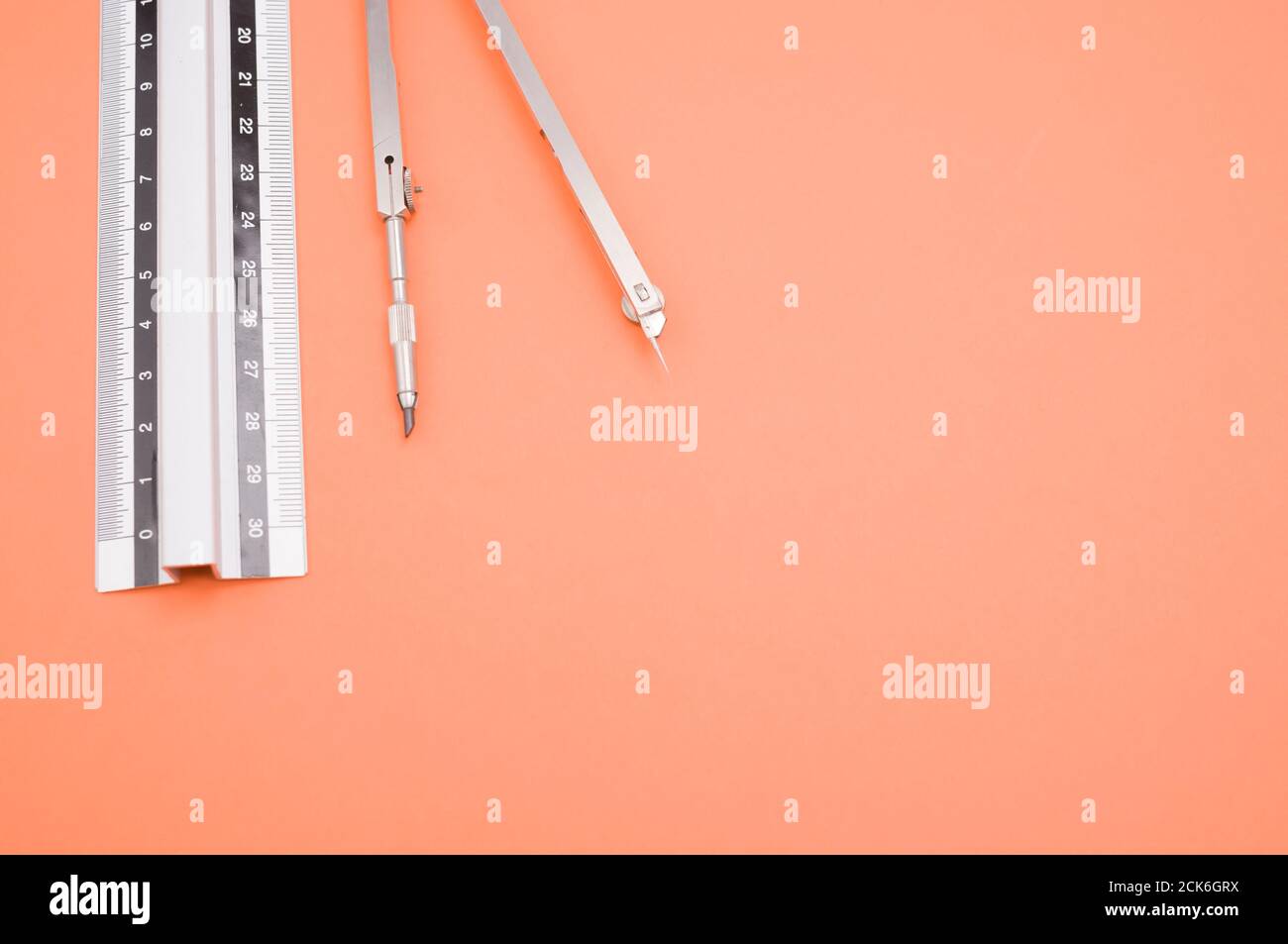 Ruler and compass on an orange background with a copy space Stock Photo ...