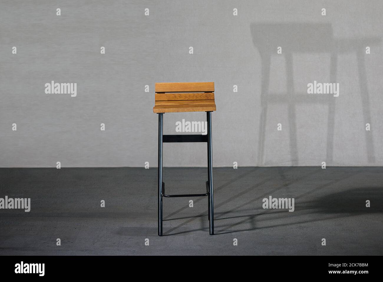 Closeup of a concave bar stool, loft-style Stock Photo - Alamy