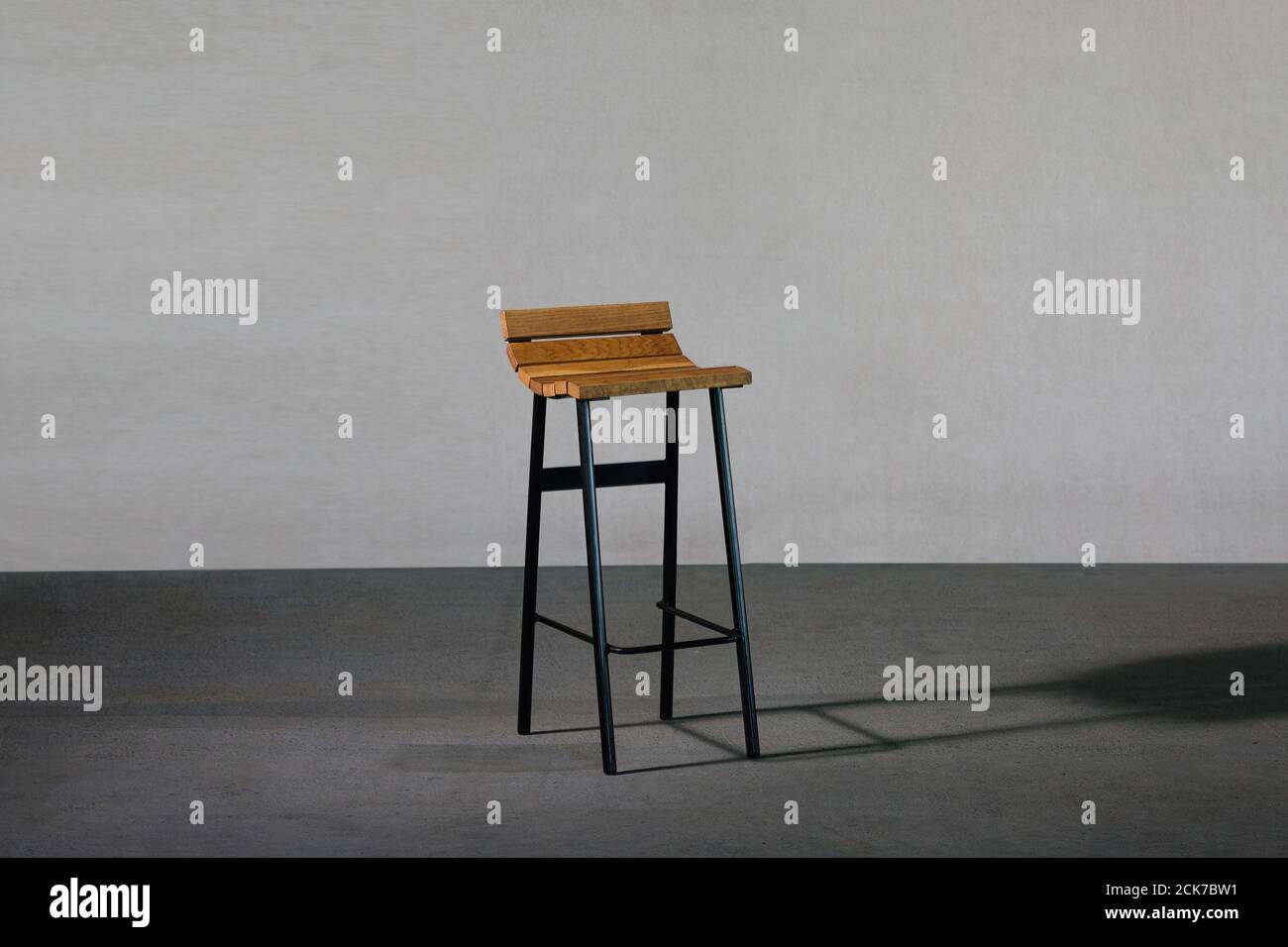 Closeup of a concave bar stool, loft-style Stock Photo - Alamy