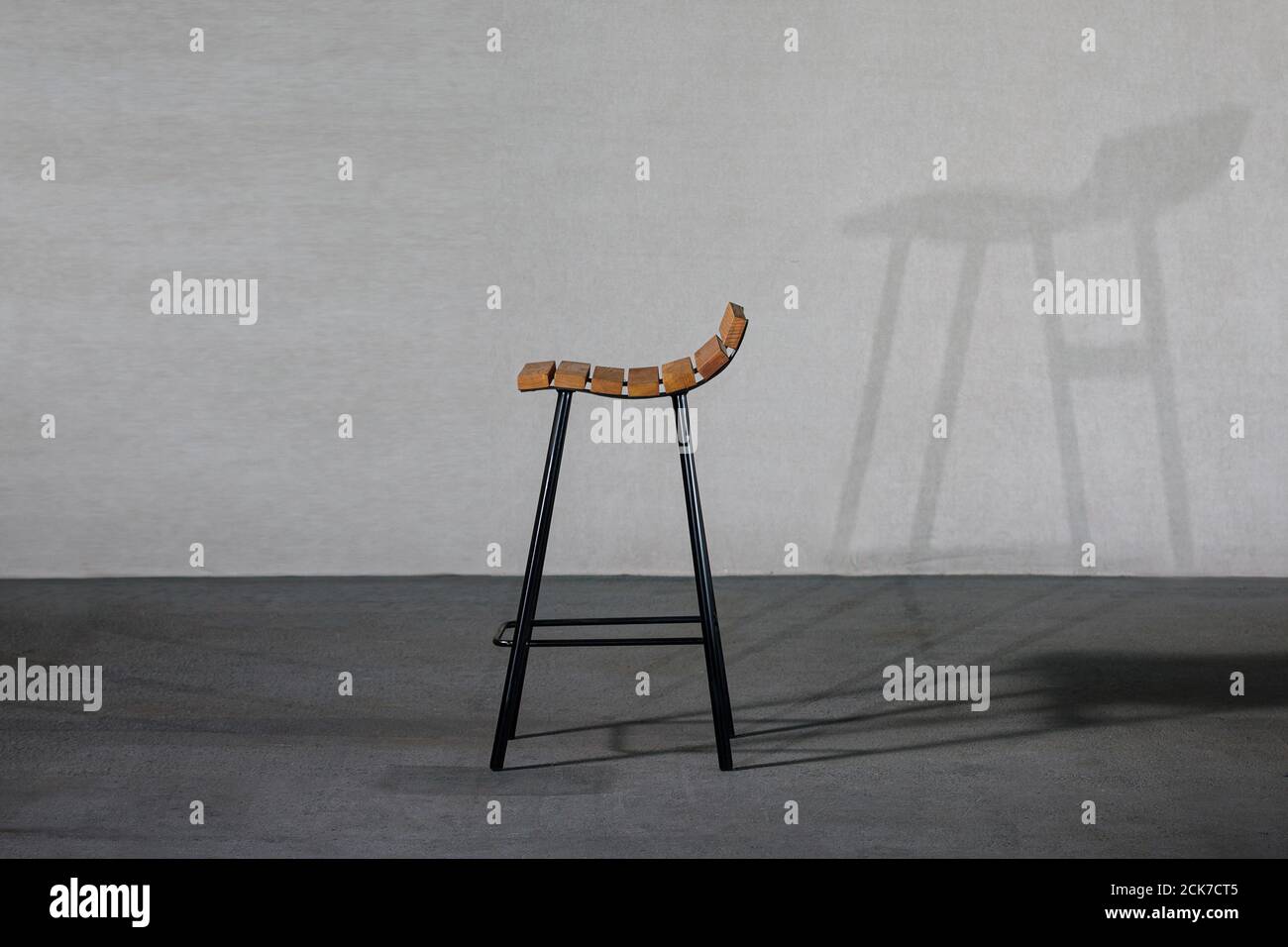 Closeup of a concave bar stool, loft-style Stock Photo - Alamy
