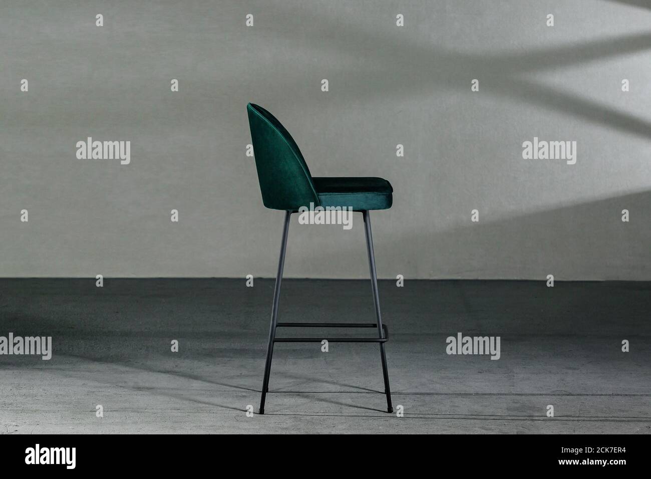 Closeup of a high, armless chair with a concave back, loft-style ...