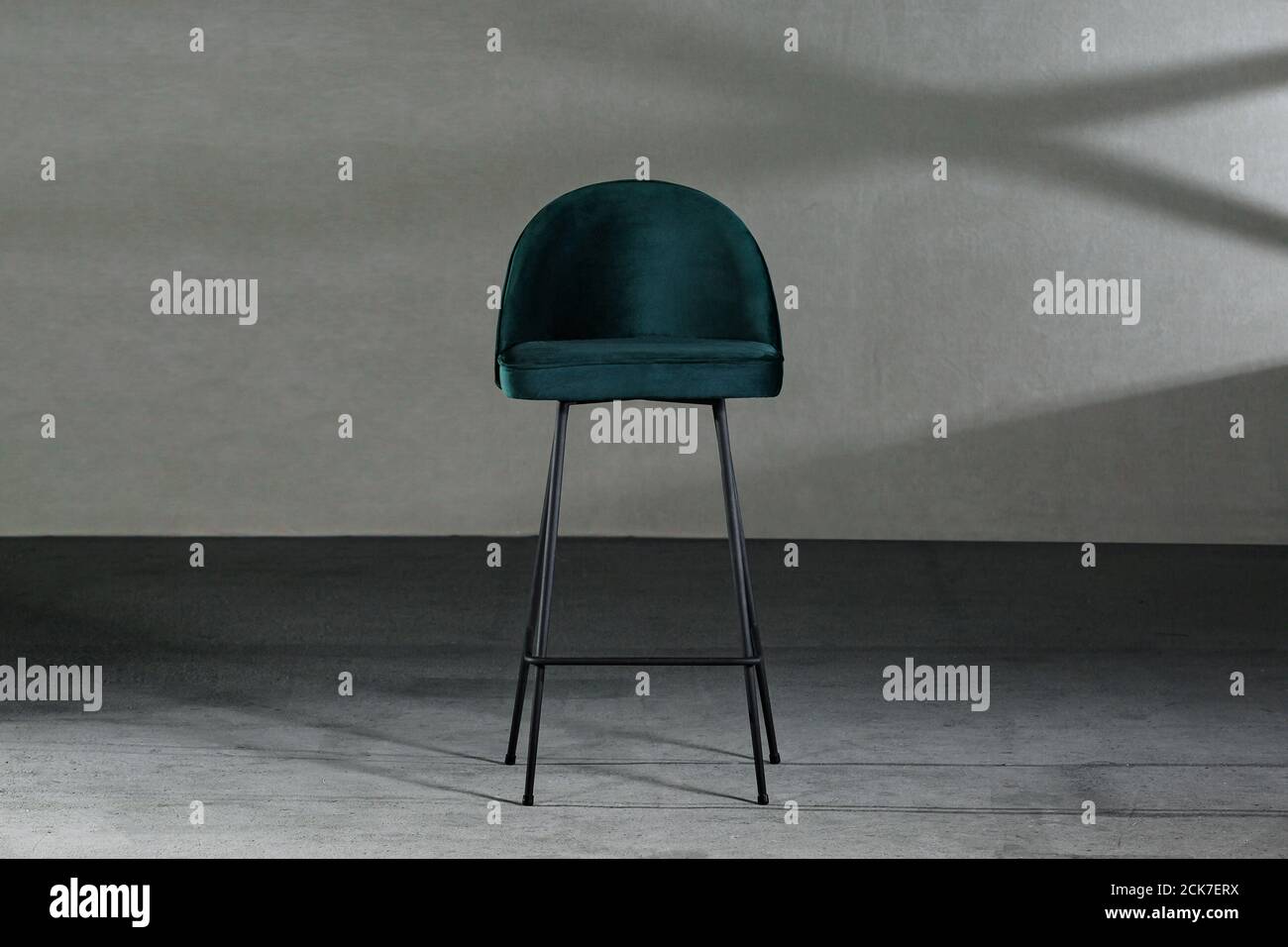 Closeup of a high, armless chair with a concave back, loft-style ...