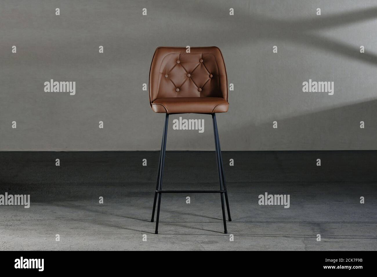 Closeup of an armless chair with a concave back, loft-style furniture ...