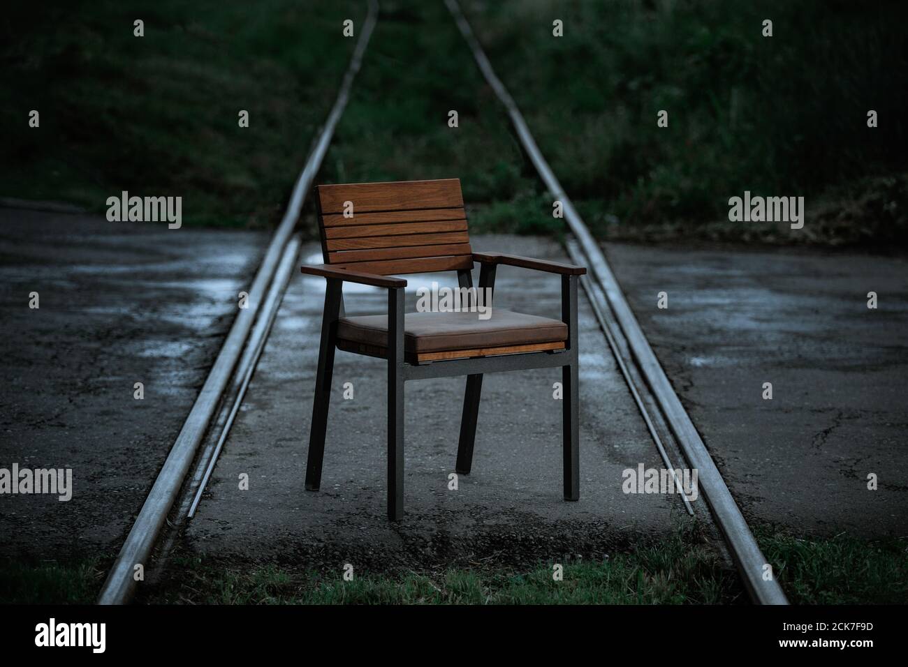 Comfortable loft-style chair left in the middle of the railroad Stock ...