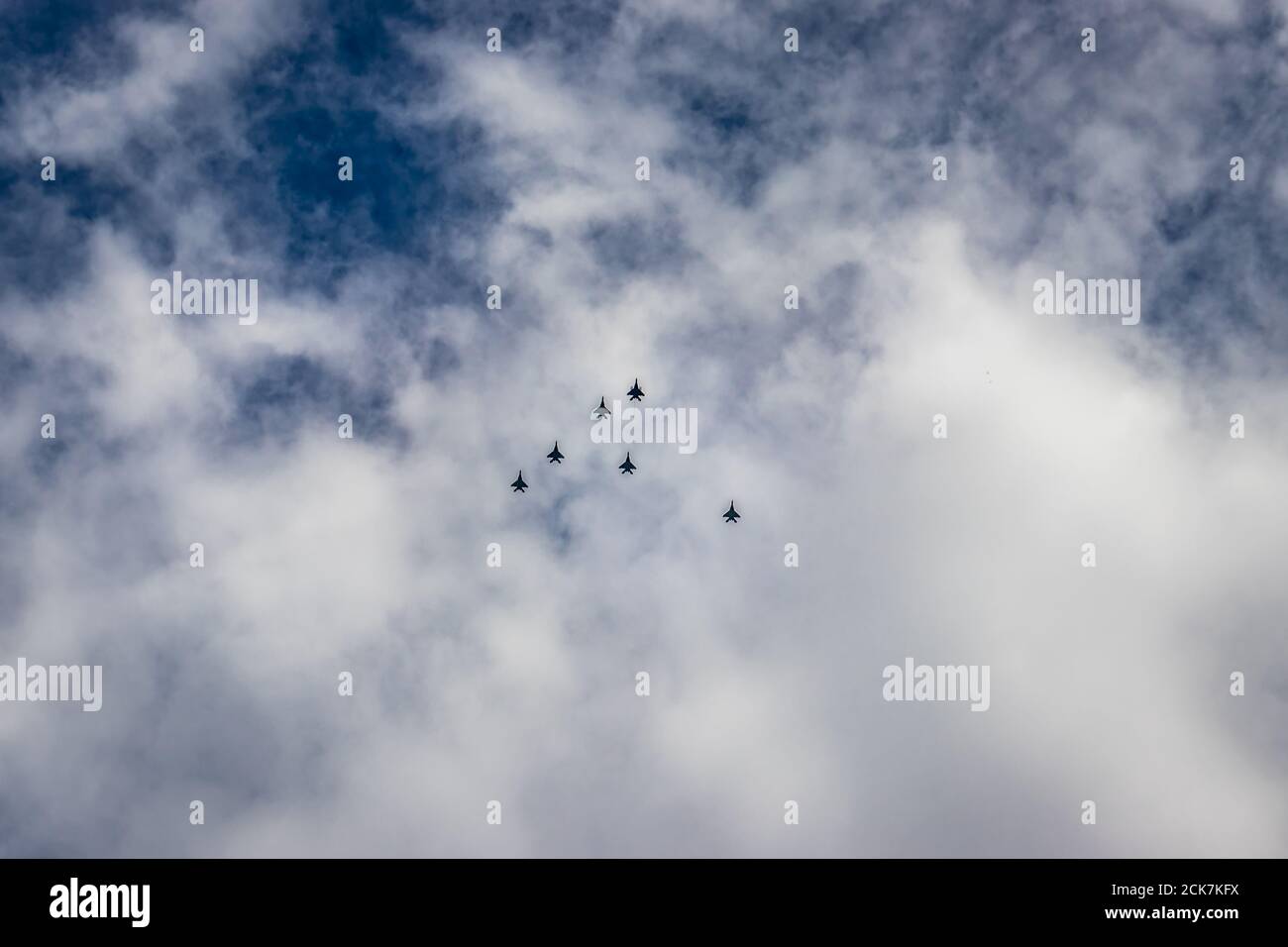 bright blue sky with jet fighter formation flying Stock Photo - Alamy