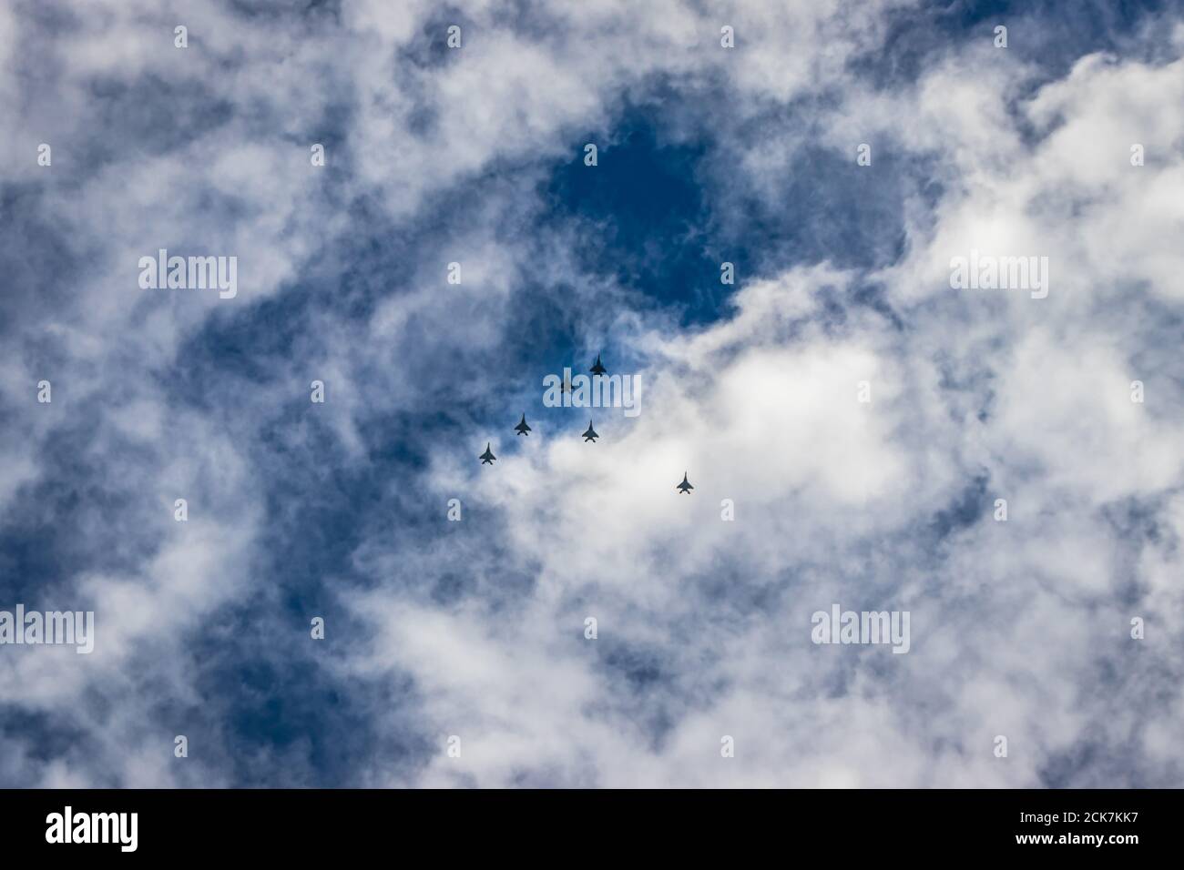 bright blue sky with jet fighter formation flying Stock Photo - Alamy