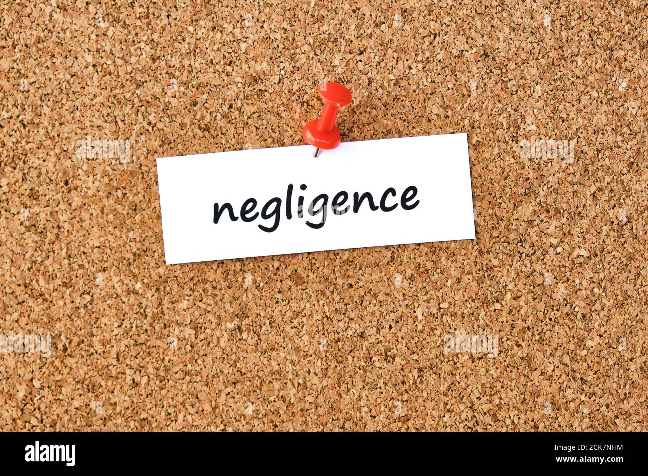 Negligence. Word written on a piece of paper or note, cork board ...