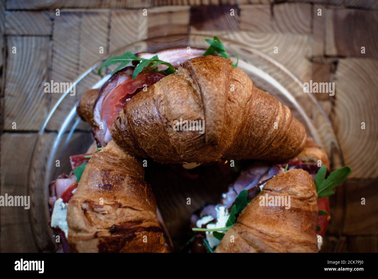 Top view shot of yummy croissants with ham and vegetables Stock Photo ...