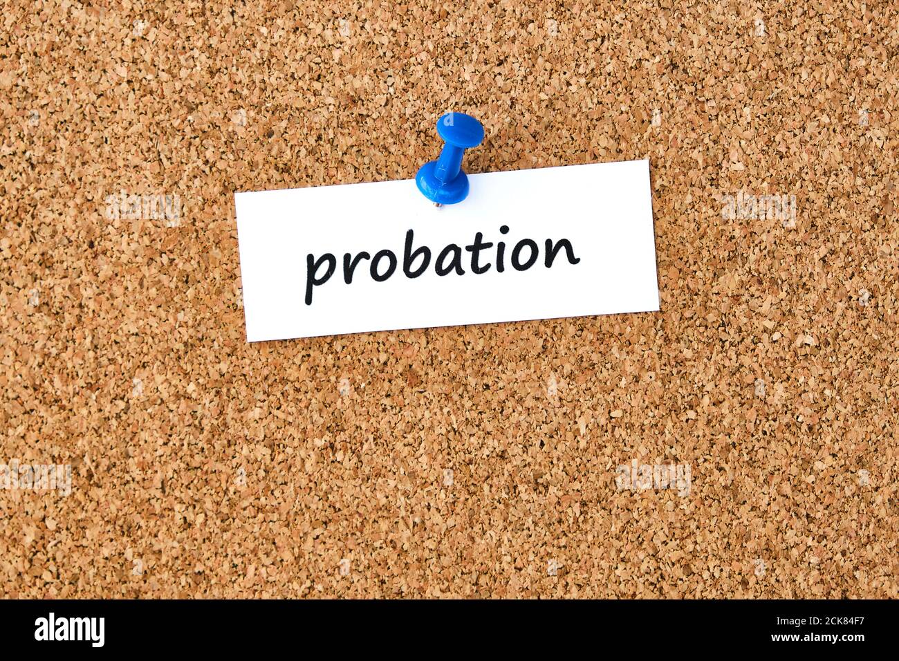 Probation. Word written on a piece of paper or note, cork board ...