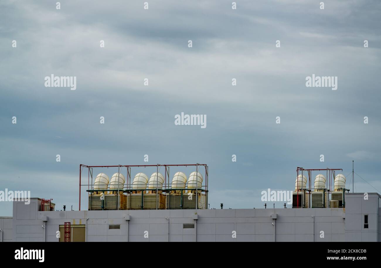 Cooling tower on roof top of building. Cooling system. Air cooled water ...