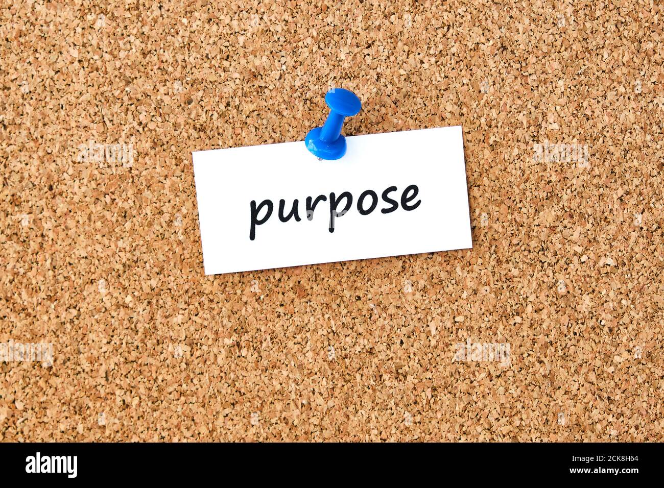 Purpose. Word written on a piece of paper or note, cork board ...