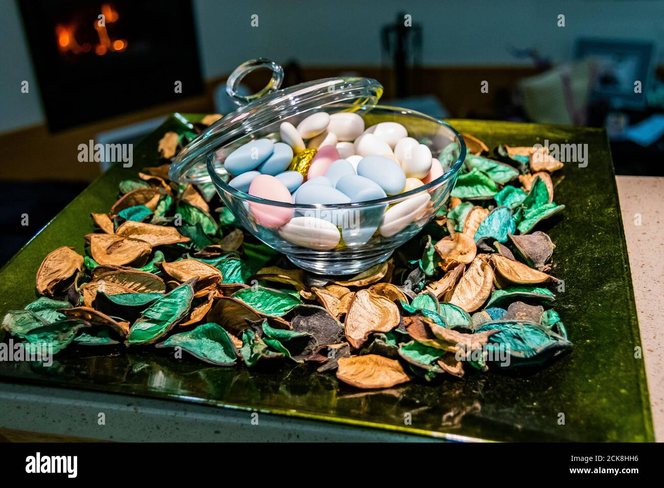 Easter almonds with variable colors in glass container at domestic home ...