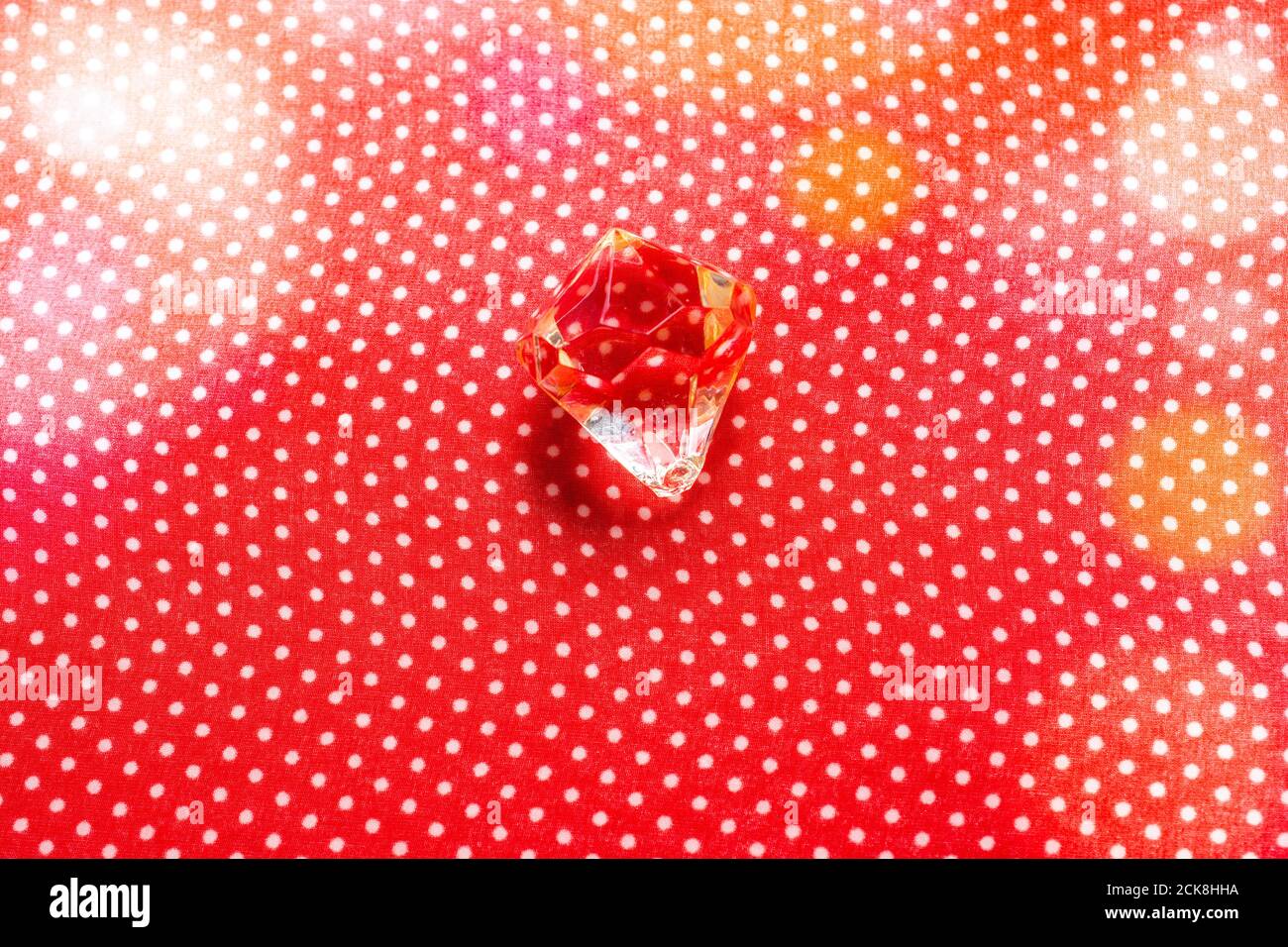 Diamond on red polka dot fabric Stock Photo - Alamy