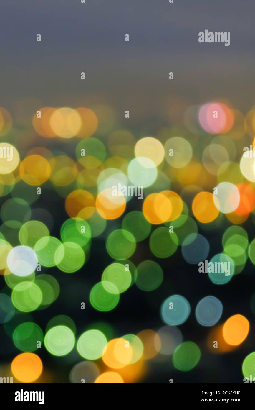 Defocus cityscape at twilight, bright and colourful blurred background ...