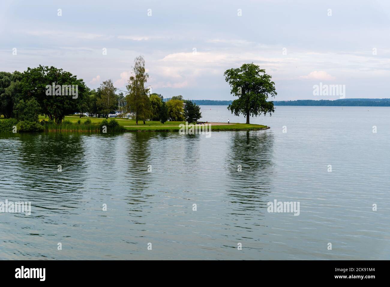 Beautiful view of a small green island in the lake Stock Photo - Alamy