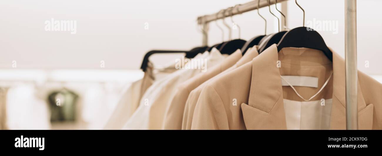 Banner for women's clothing store in beige colors. Selective focus ...